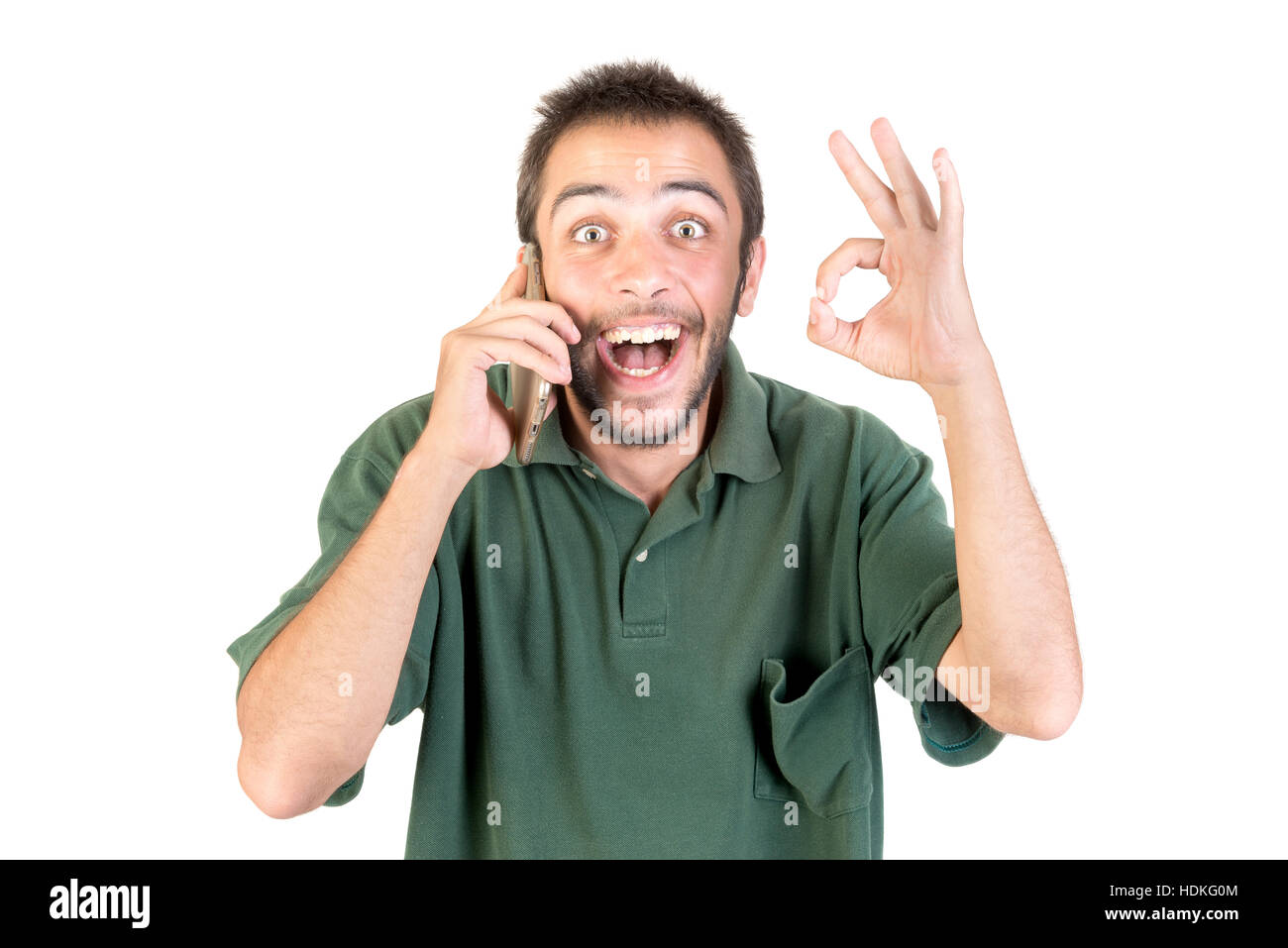 young man with cellphone doing funny faces isolated in white Stock ...