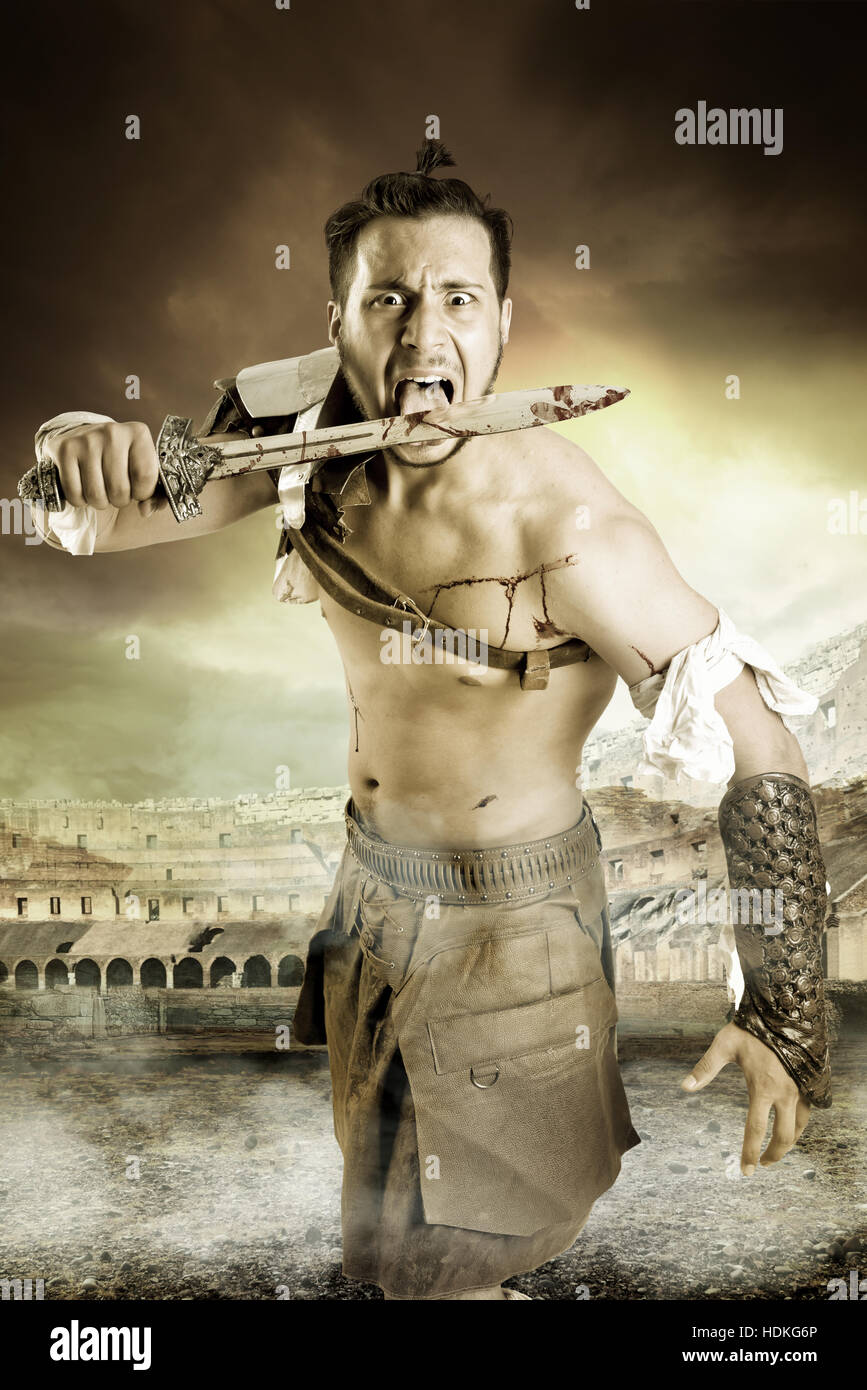 Ancient warrior or Gladiator in the arena with sword Stock Photo - Alamy