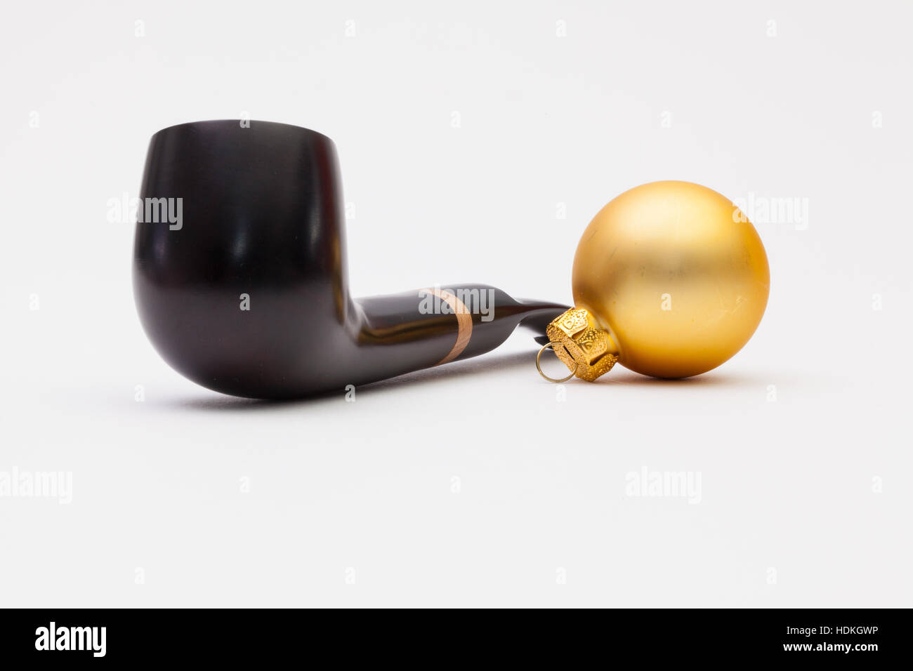 Luxury tobacco pipe and Christmas decoration on the white background ...