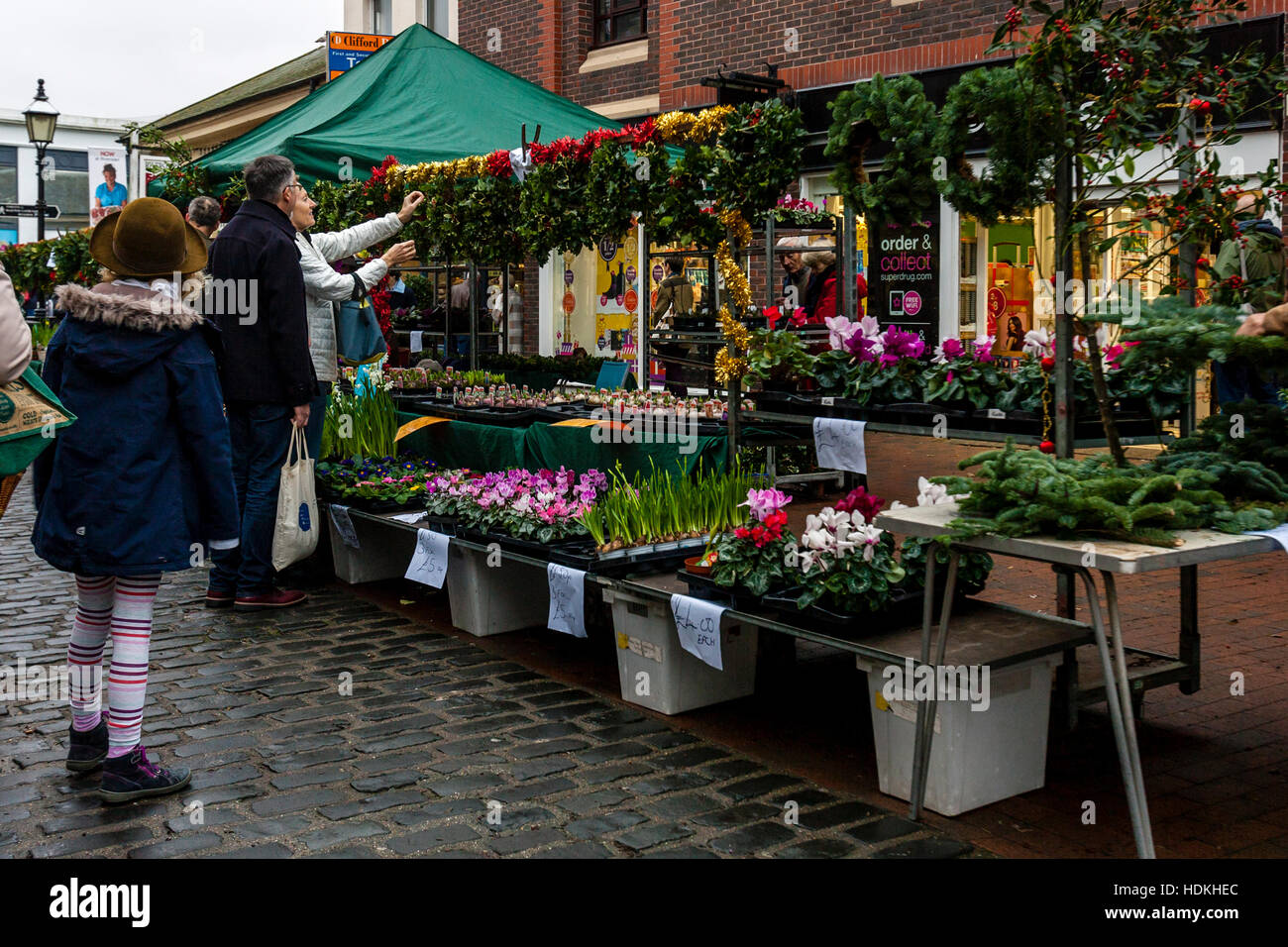 Local People Buying Christmas Wreaths From A Stall In The High Street ...