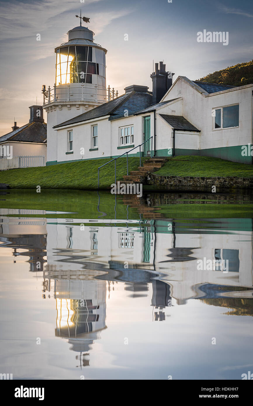The old lighthouse in fantastic reflection in the calm waters , A very ...