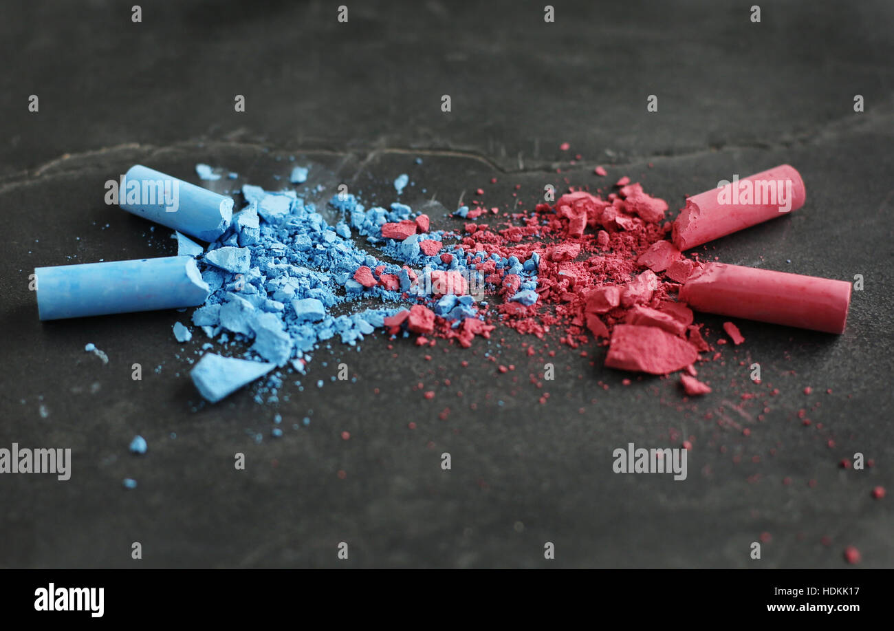 Blue chalk and pink chalk crumbled and blending together Stock Photo ...