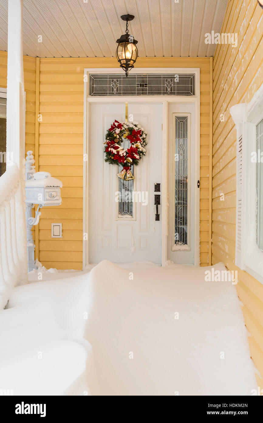 A front entrance door with snow drifts after a blizzard in Winkler ...