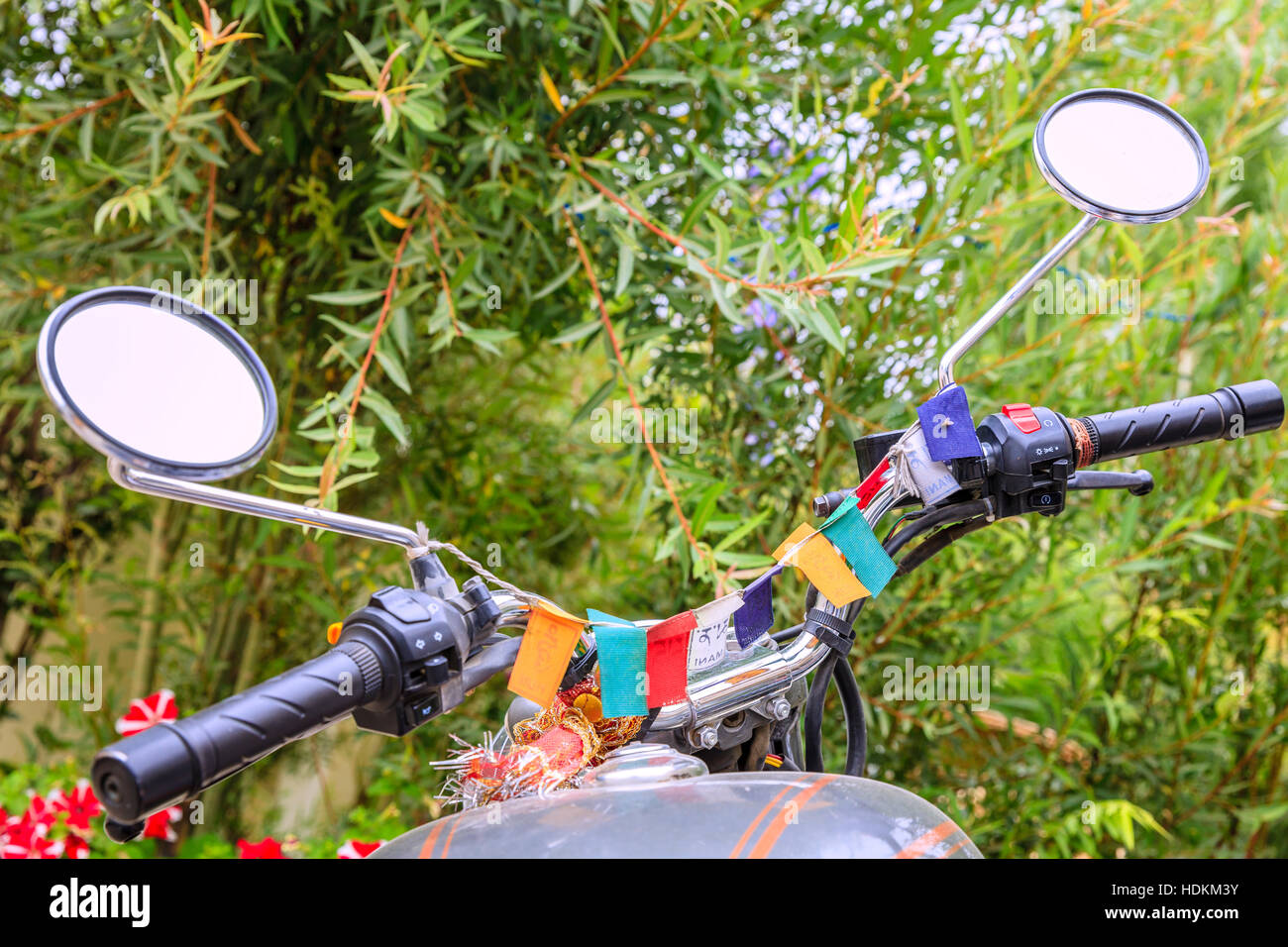 Steering bars of a motorcycle decorated with Buddhist flags Stock Photo ...