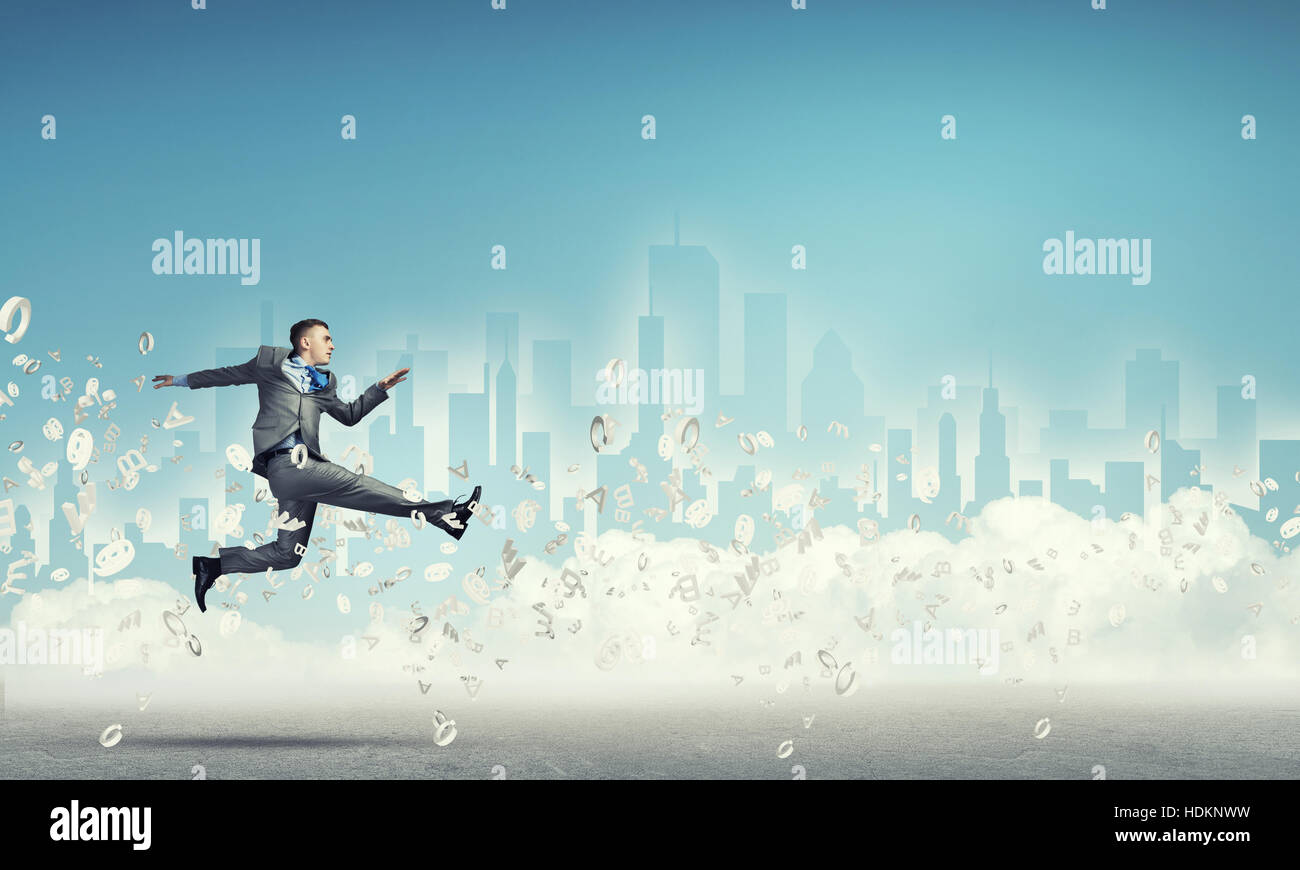 Businessman jumping high Stock Photo - Alamy