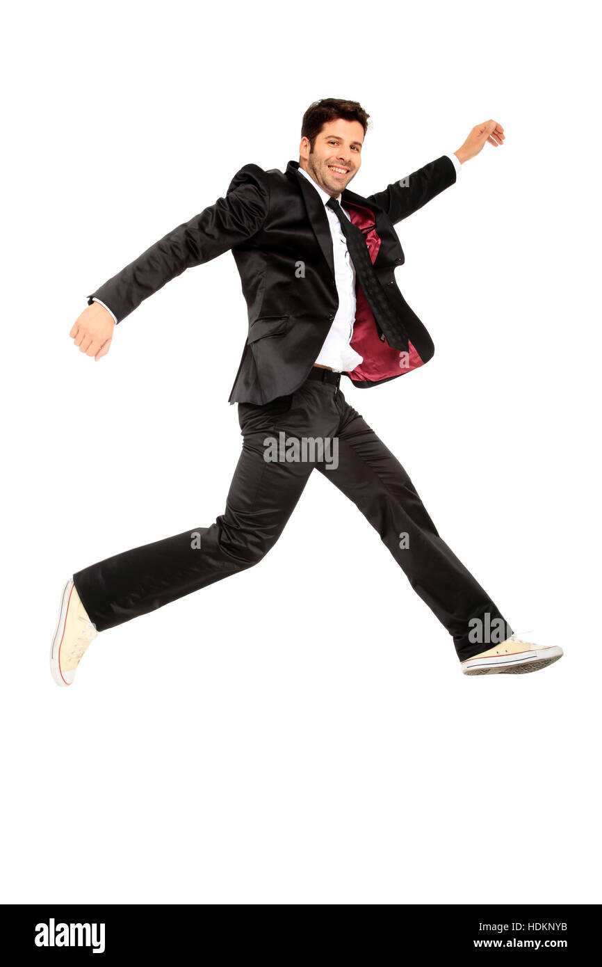 handsome jumping man on suit isolated on a white background Stock Photo ...