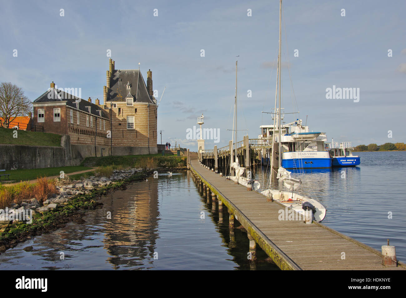 Harbour of Veere with medieval tower and municipal ferry boat Stock ...
