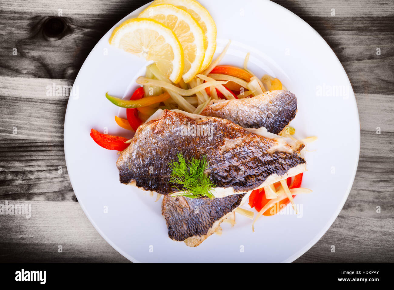 Fillet of sea bream with fennel and pepper Stock Photo - Alamy