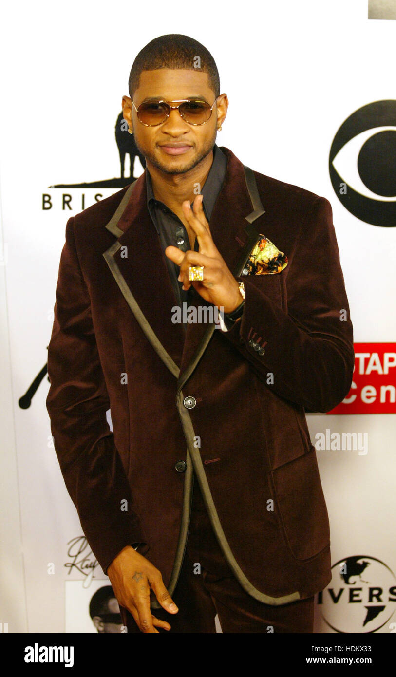 Singer Usher poses for photographers before a concert paying tribute to ...