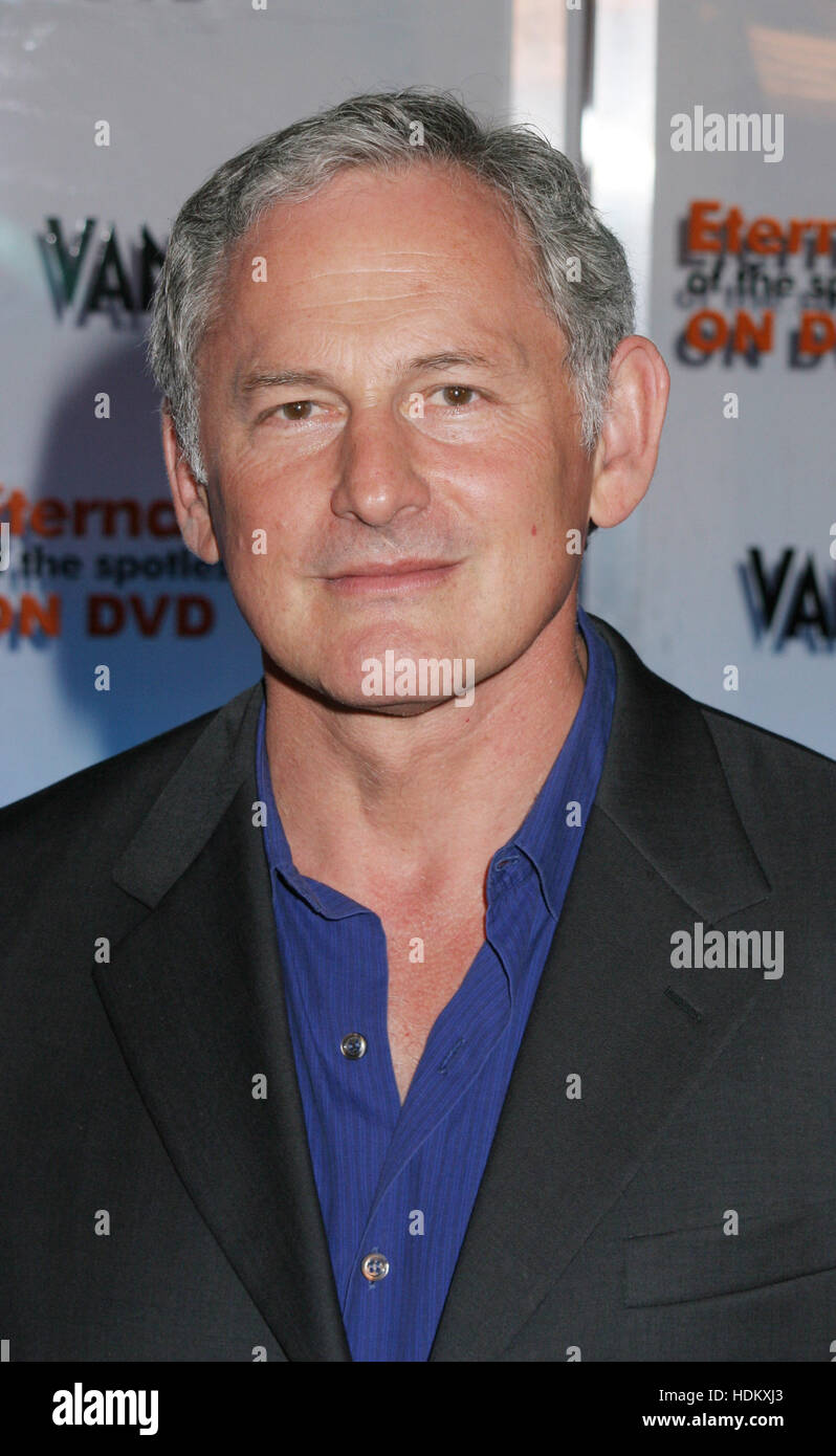 Actor Victor Garber poses for photographers at the DVD launch party for ...