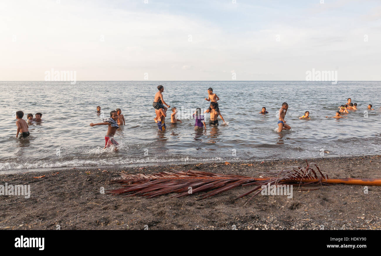 Indonesian children playing in the water hi-res stock photography and ...