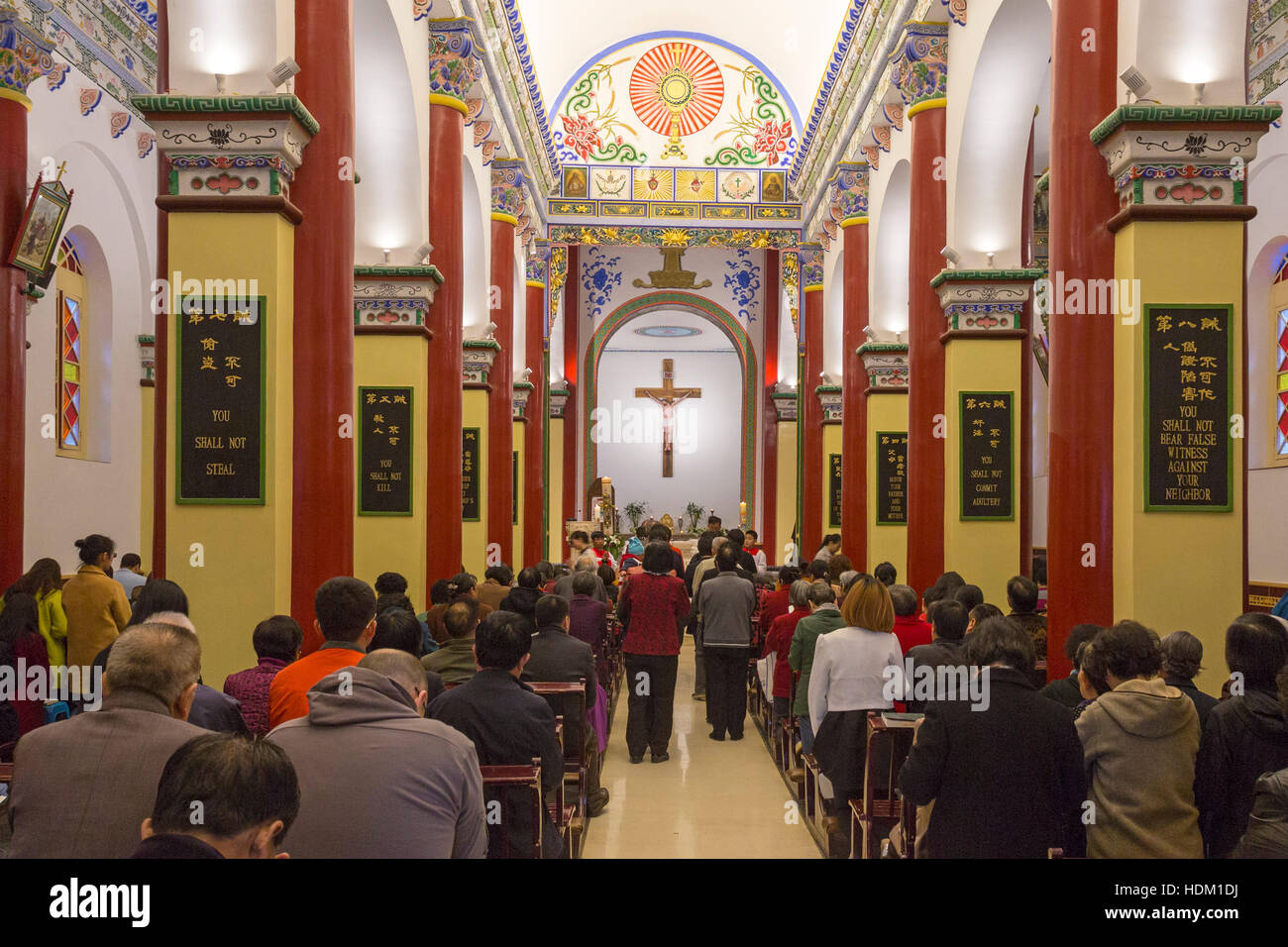 Congregation receiving communion at Tianshuijing Catholic Church, Xian ...