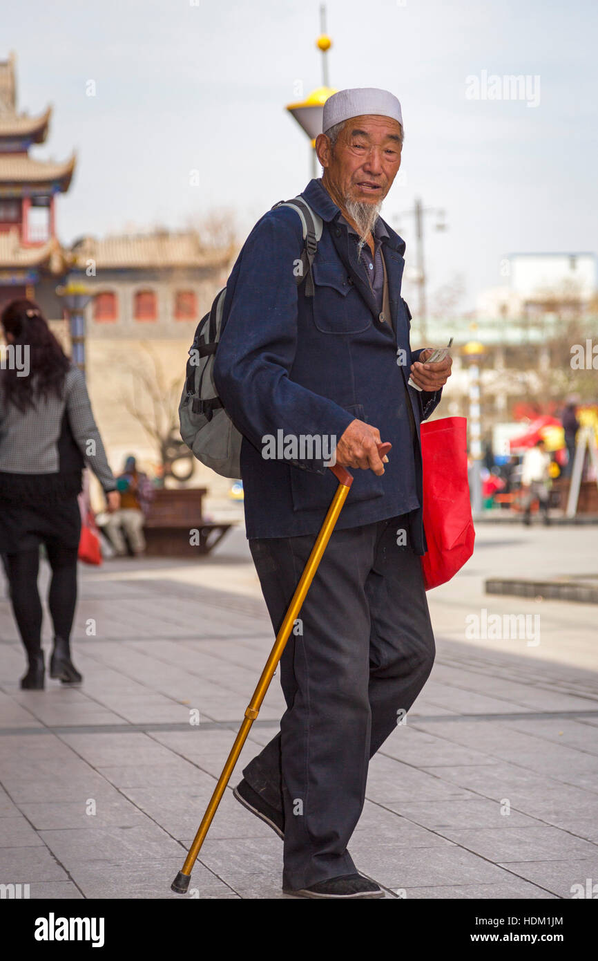 Old chinese man walking stick hi-res stock photography and images - Alamy