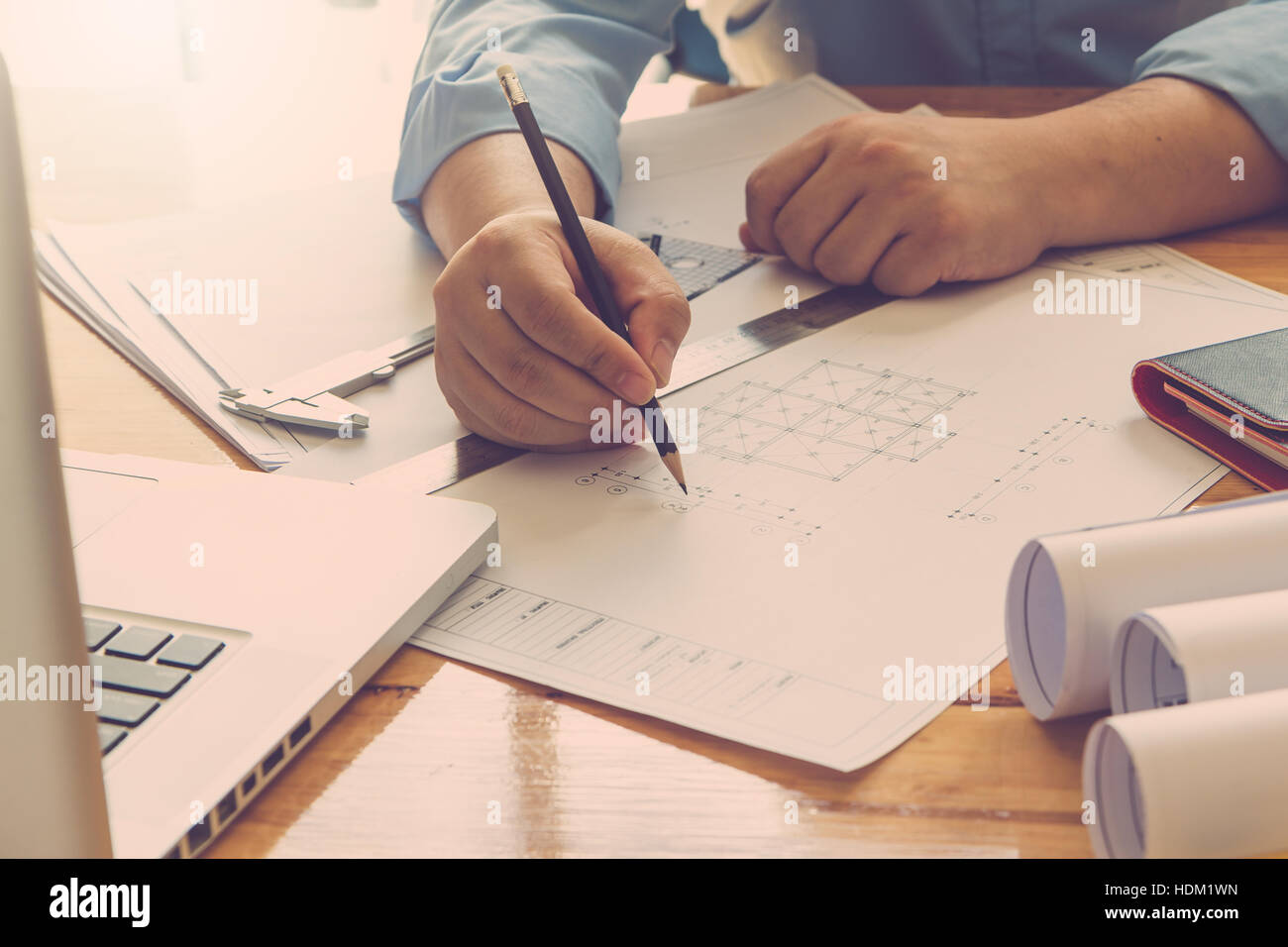 Architect concept, Architects working with blueprints in the office ...