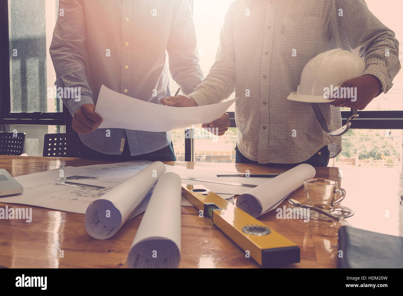 Architect concept, Architects working with blueprints in the office ...