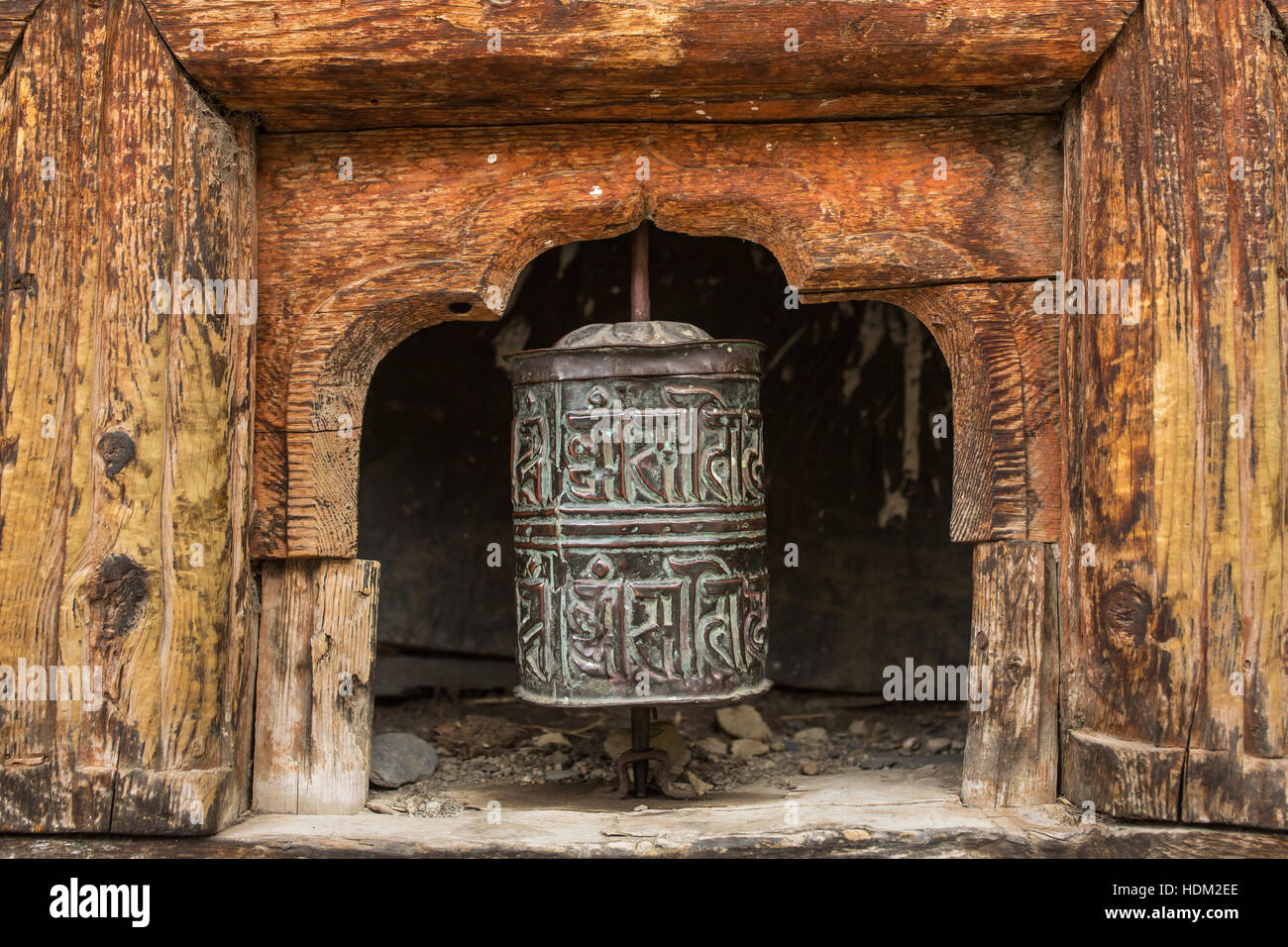 Buddhist prayer mani wall with prayer wheels in nepalese village on the ...