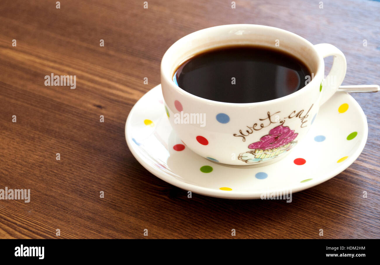Coffee cup on the wooden table Stock Photo - Alamy