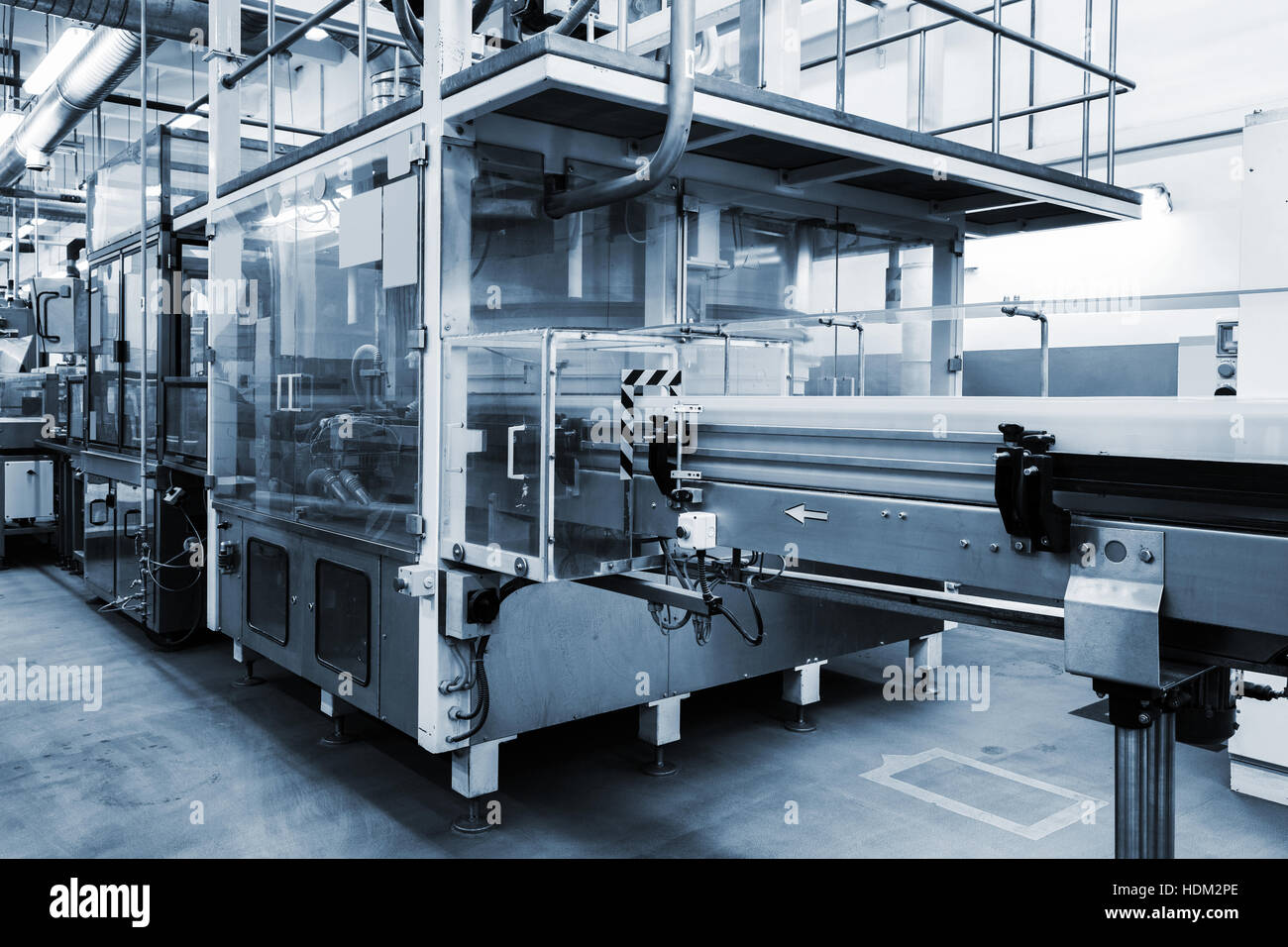 conveyor working at a modern factory Stock Photo - Alamy