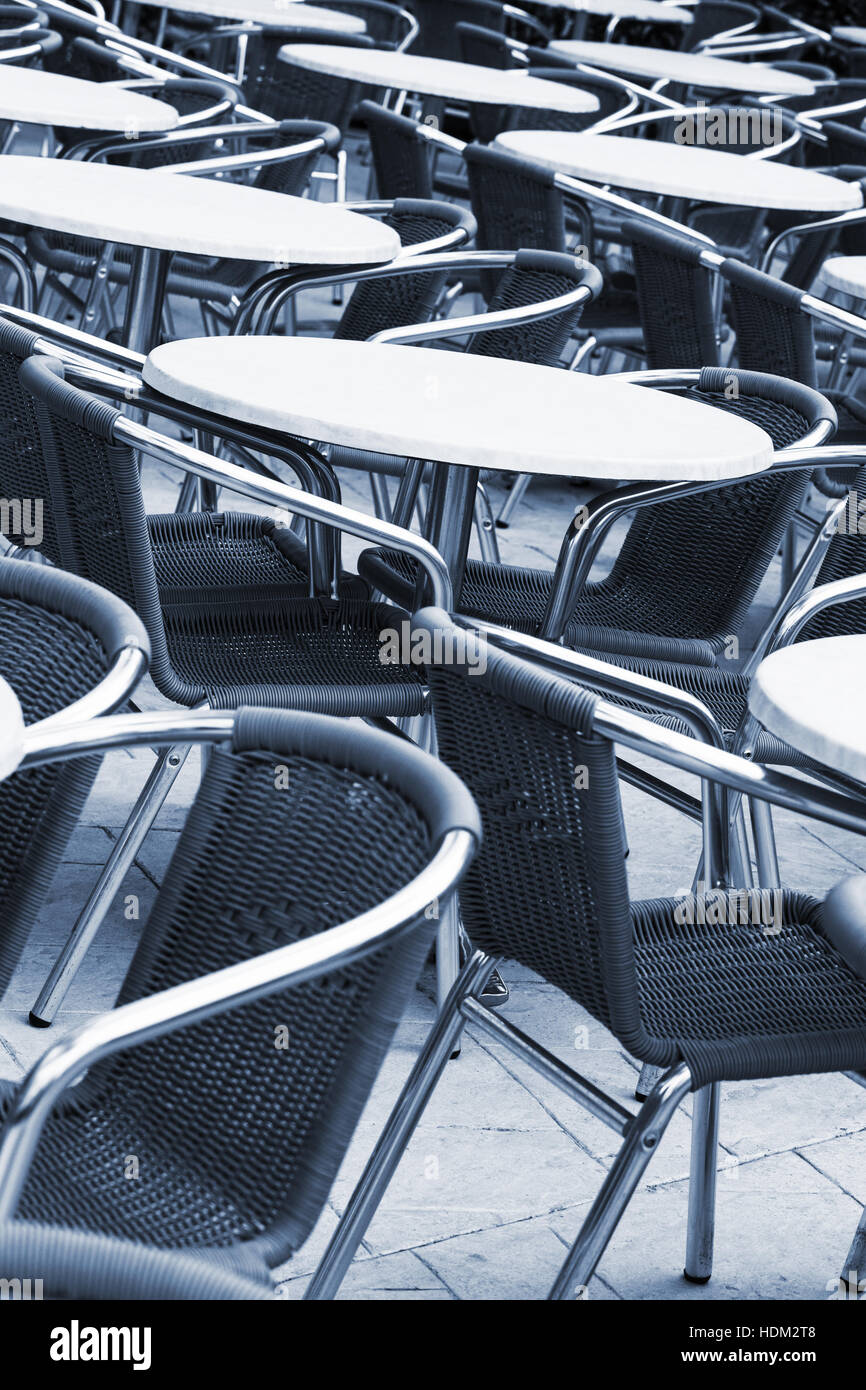 Row white metal tables chairs hi-res stock photography and images - Alamy