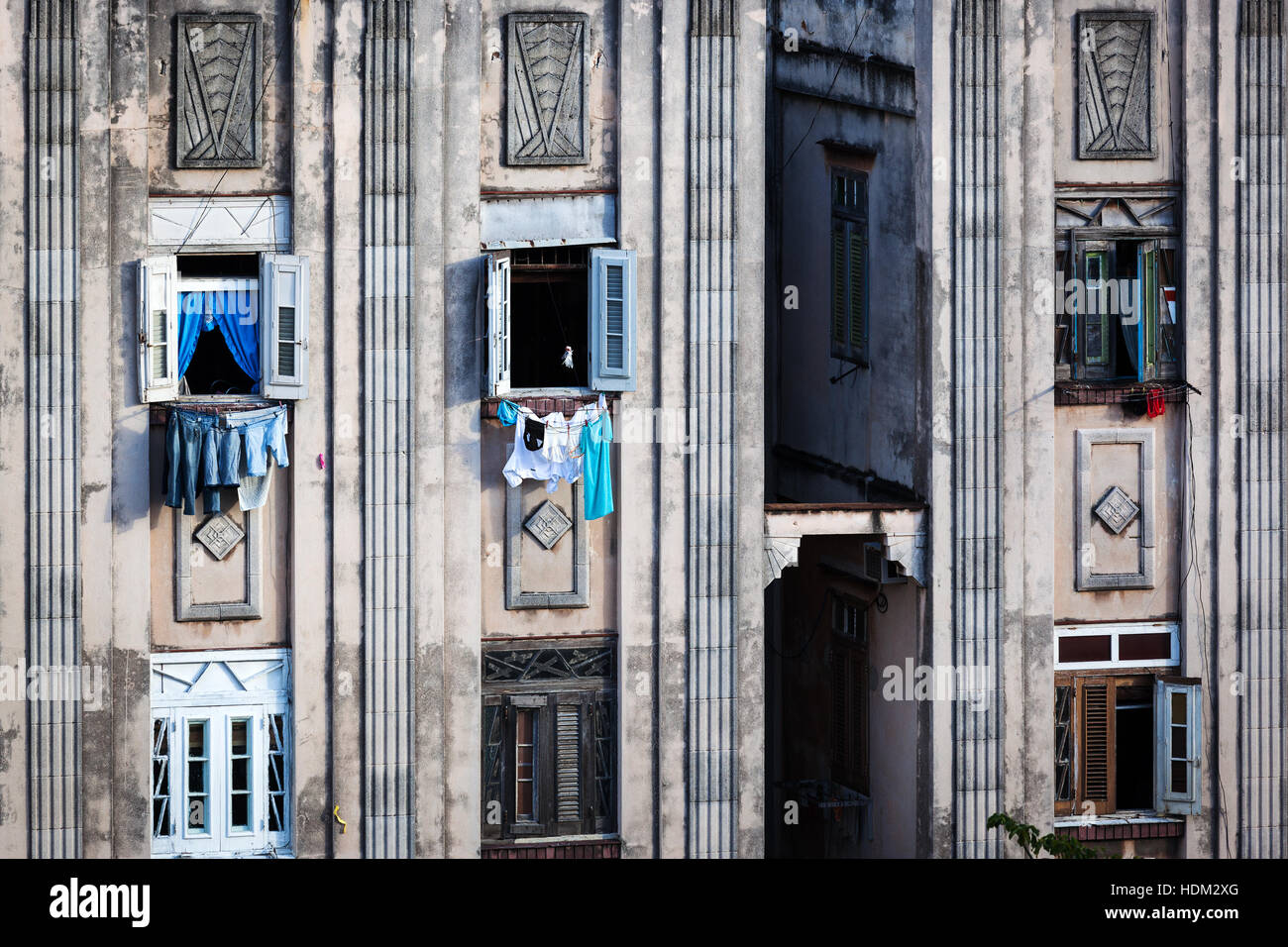drying clothes in the windows of the old house Stock Photo - Alamy