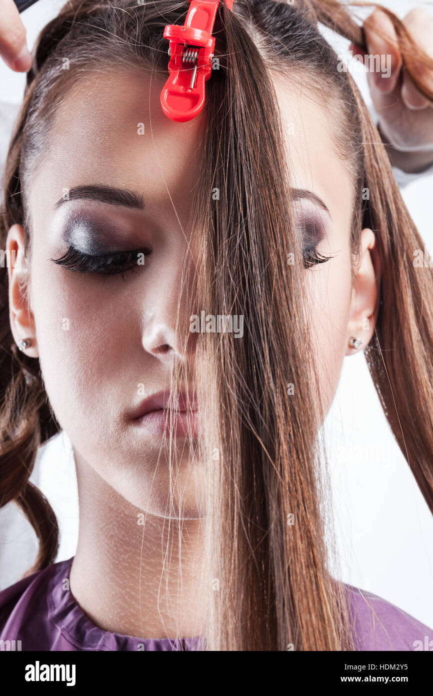 creating hairstyles in a hairdressing salon Stock Photo - Alamy