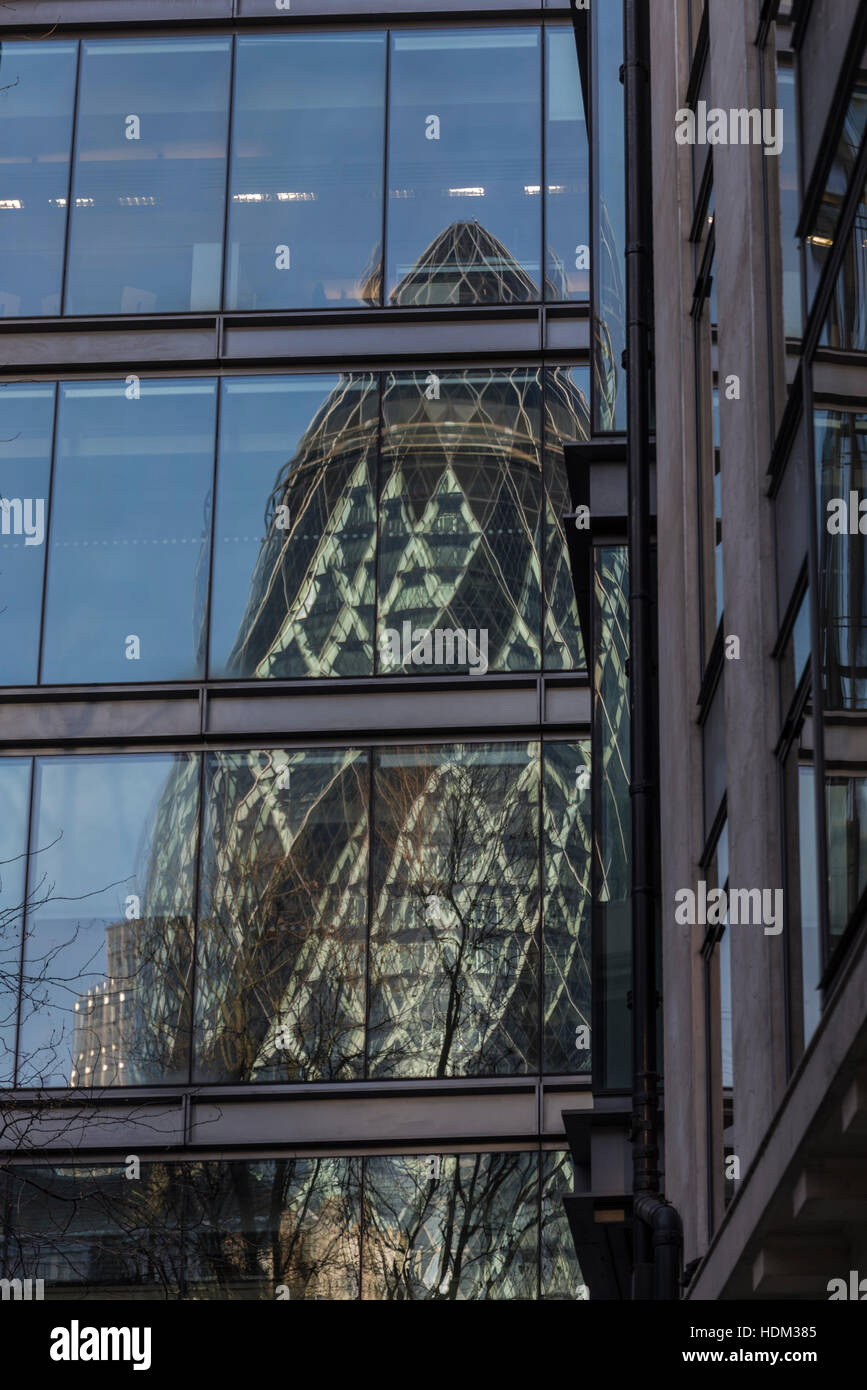 A reflection of the London building known as the Gherkin in the glass ...