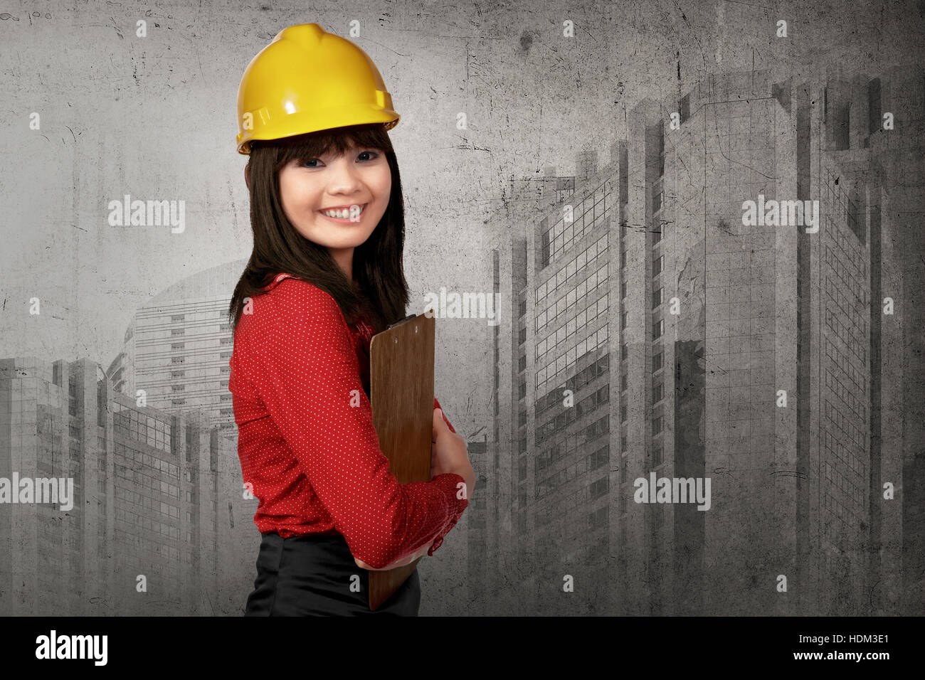 Asian worker using safety helmet with cityscape as the background Stock ...