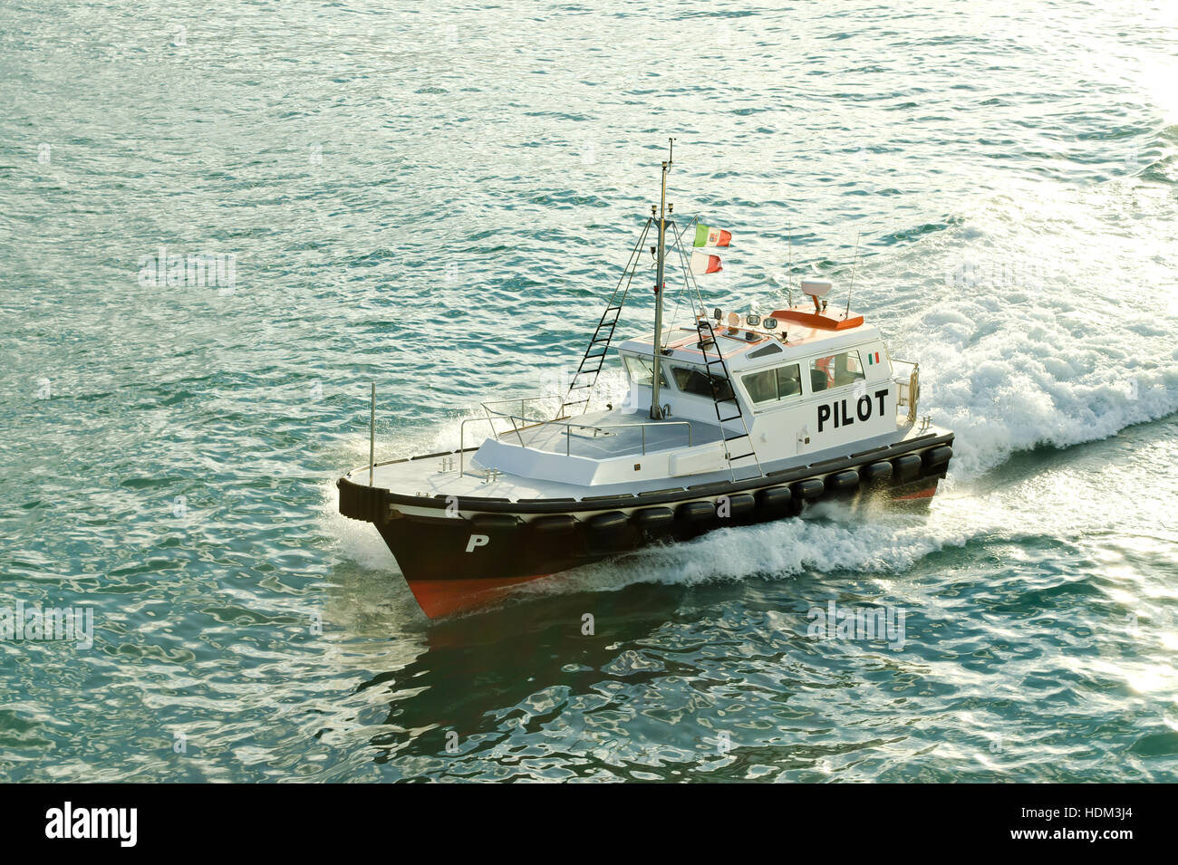 a pilot boat in the harbor Stock Photo - Alamy
