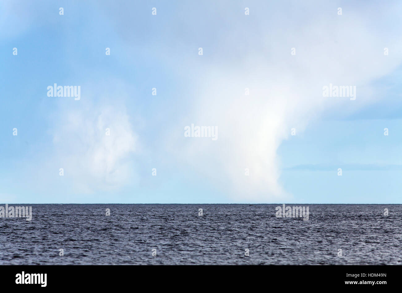 Shower at sea. Rain, hail and snow. Water, waves and unstable weather ...