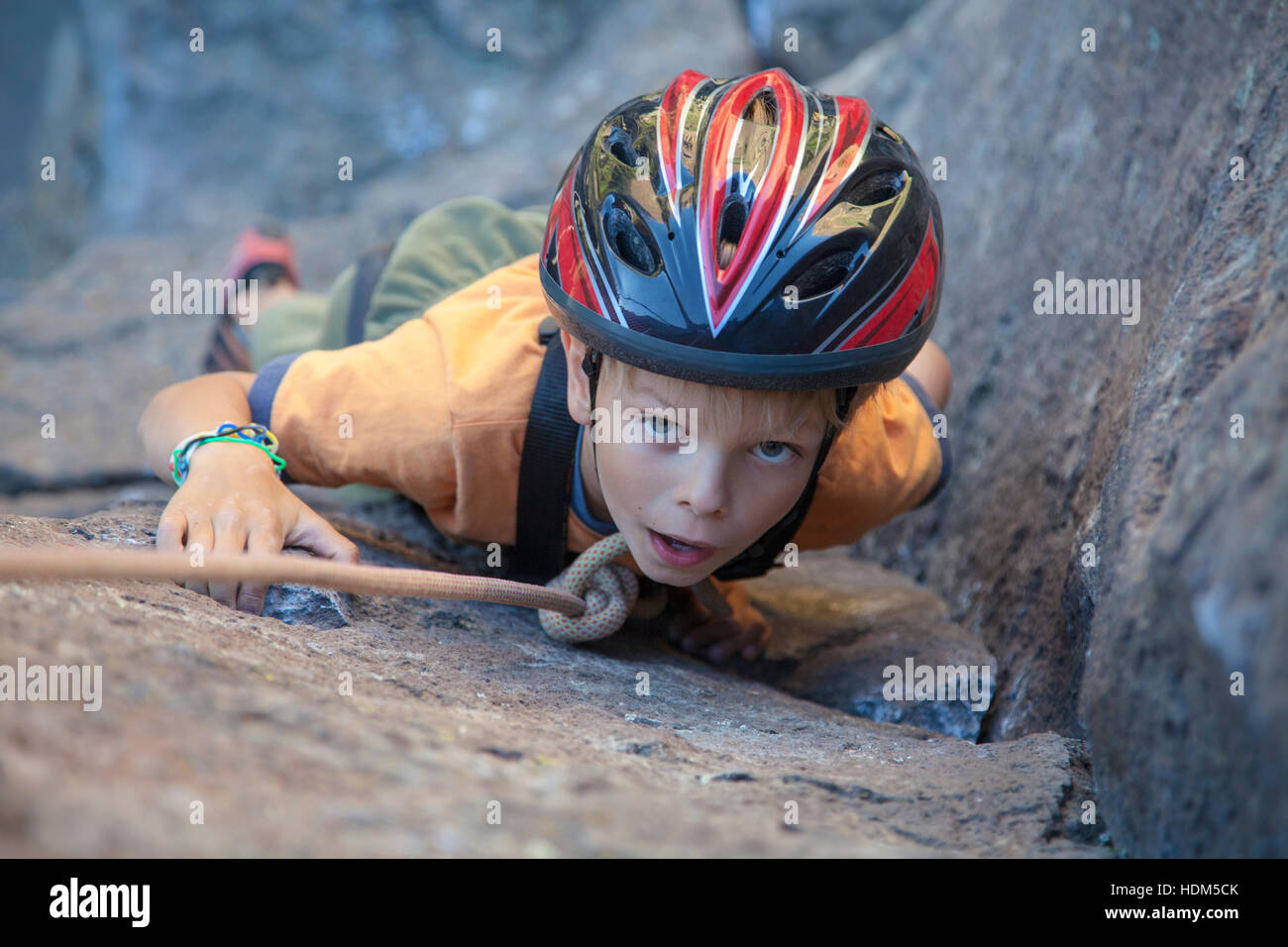 7 years old kid child is climbing in Smith rock State Park, Oregon, USA ...