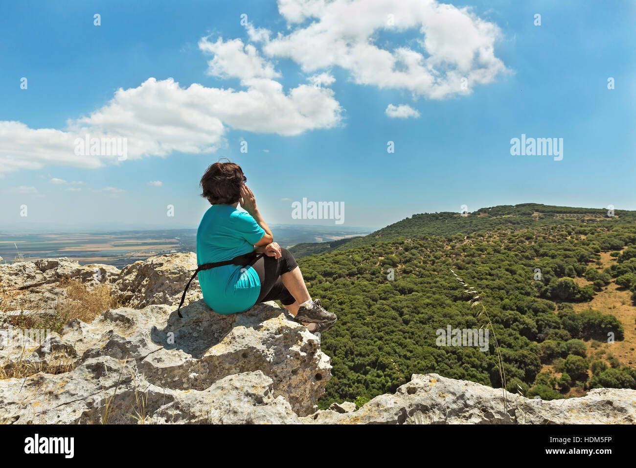 Woman hiking to the top of a mountain hi-res stock photography and ...
