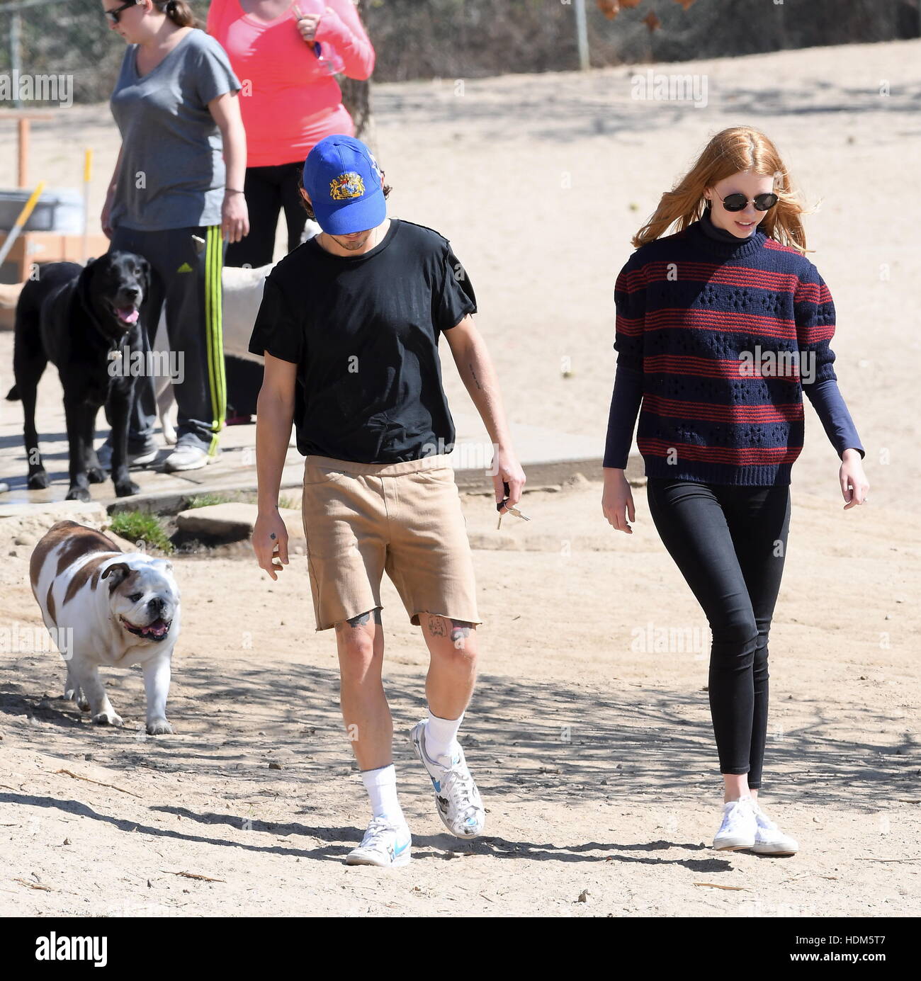 Newly weds Shia LaBeouf and Mia Goth out at a park with their bulldog ...