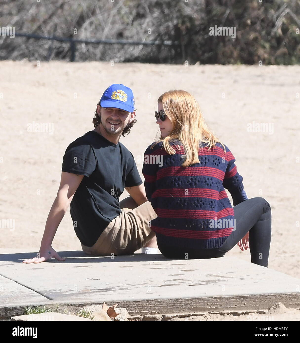Newly weds Shia LaBeouf and Mia Goth out at a park with their bulldog ...