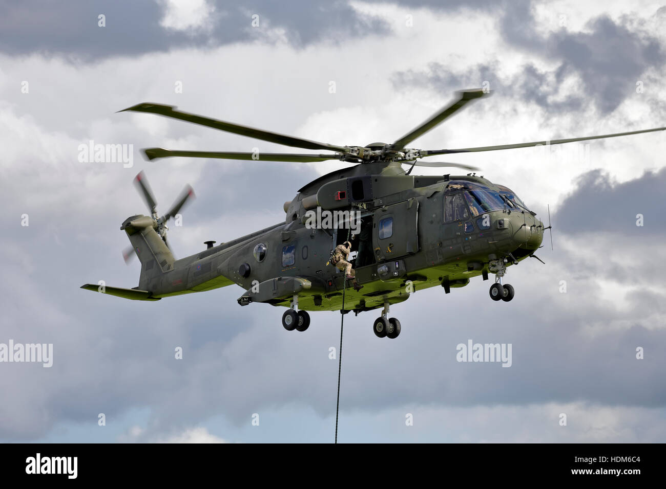 A Royal Marine Commando fast ropes from a Royal Air Force ...