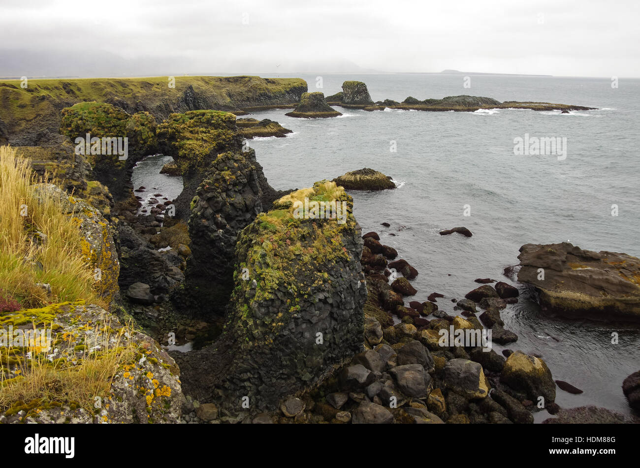 Atlantic ocean and black rock cliff of western Iceland coast ...