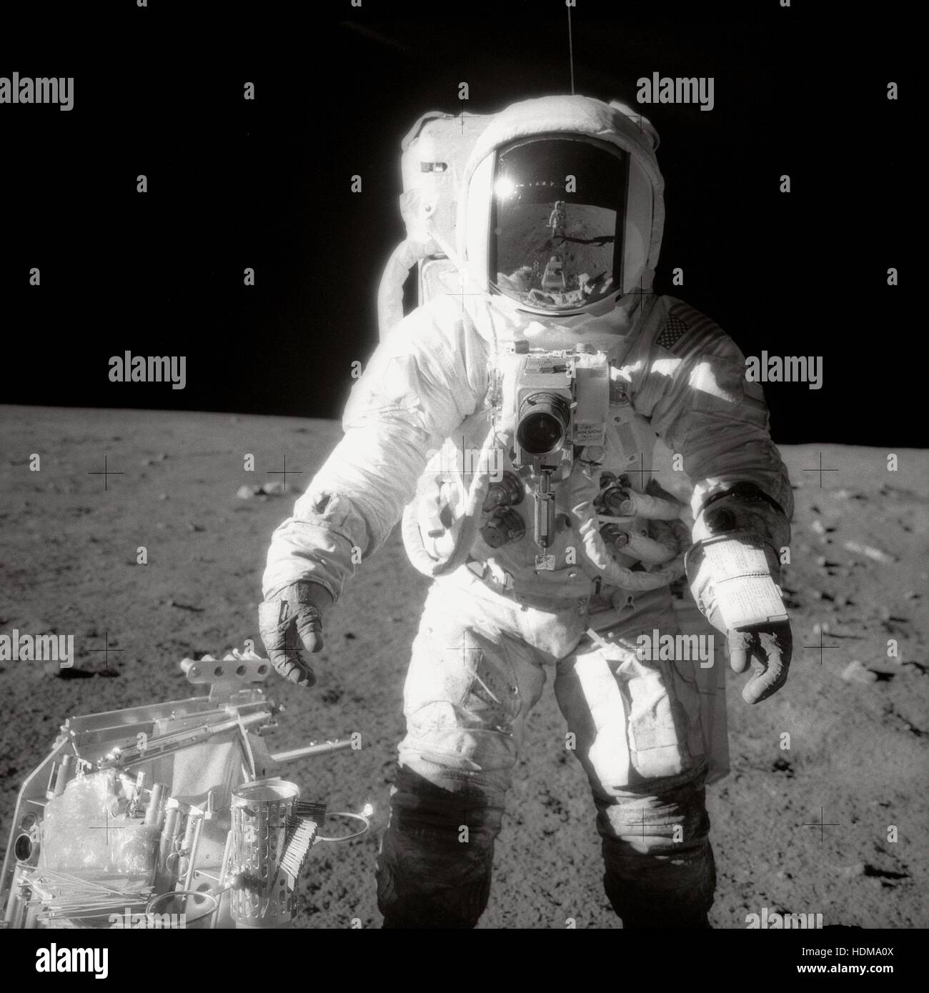 NASA Apollo 12 lunar landing mission astronaut Alan Bean pauses near a ...