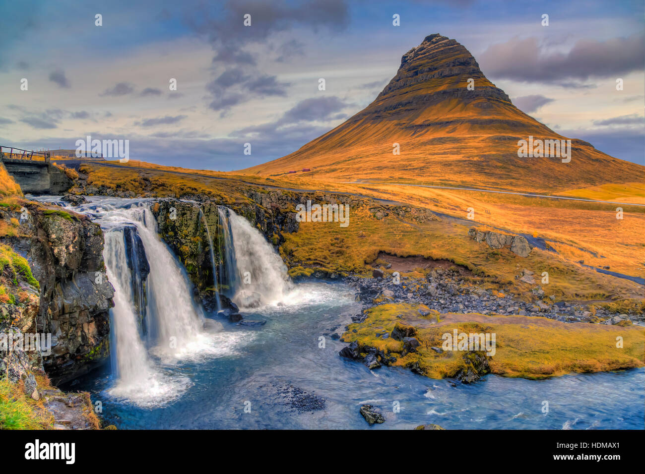 Mt Kirkjufel and Kirkjufelsfoss waterfall near Grundarfjordur in ...