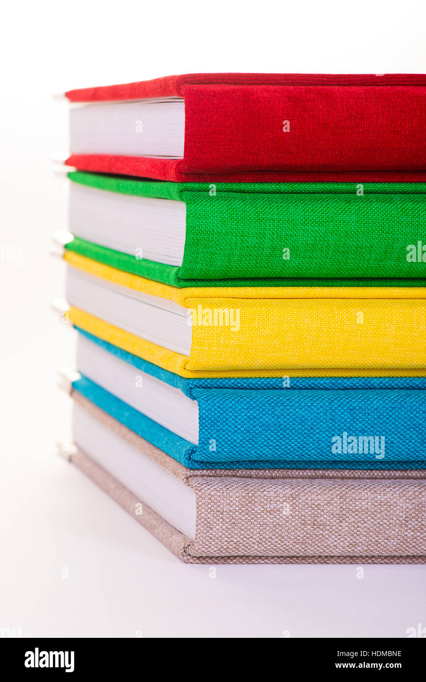 Multicolored book textile cover. Photobooks on a white background Stock ...