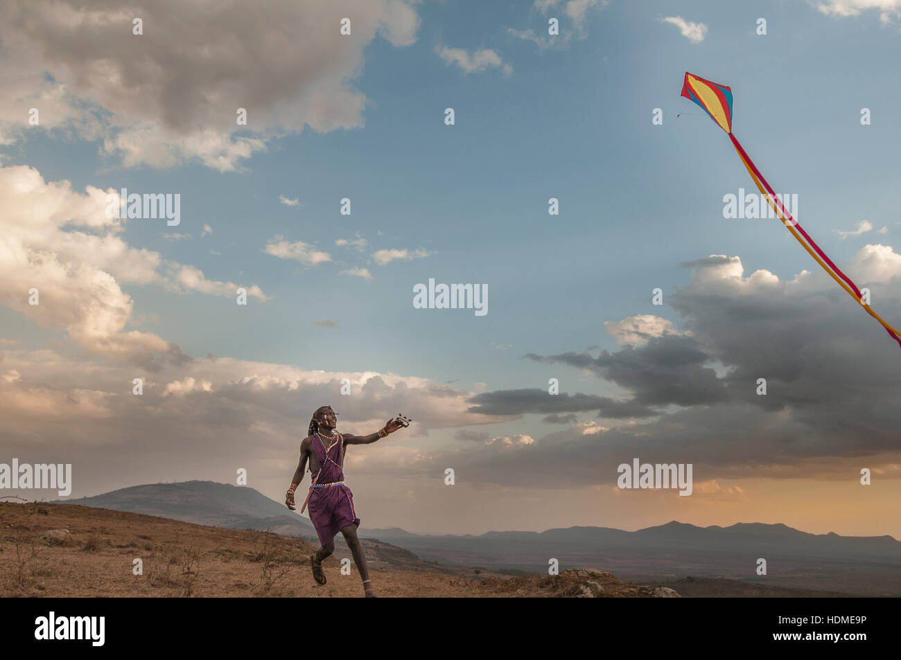 Maasai Warrior learning to fly a kite. Kenya, Africa Stock Photo - Alamy