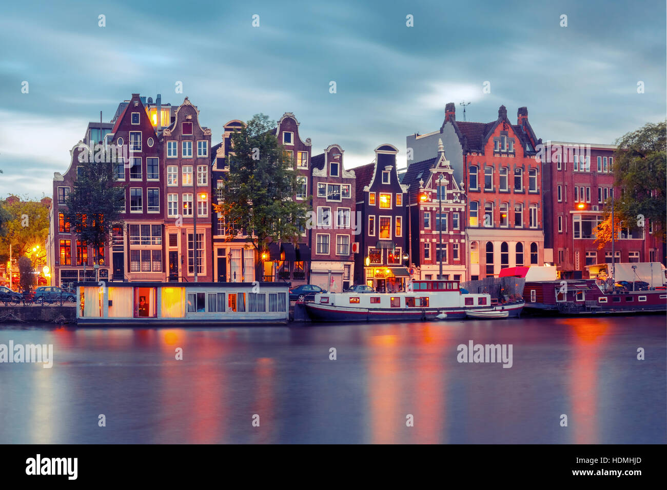 Night city view of Amsterdam canal with dutch houses Stock Photo - Alamy