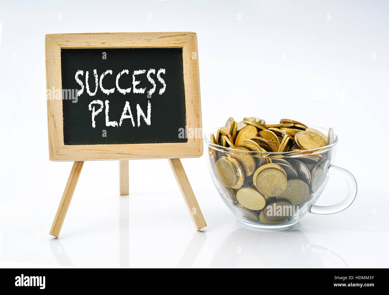 Cup coins with economic concept Stock Photo - Alamy