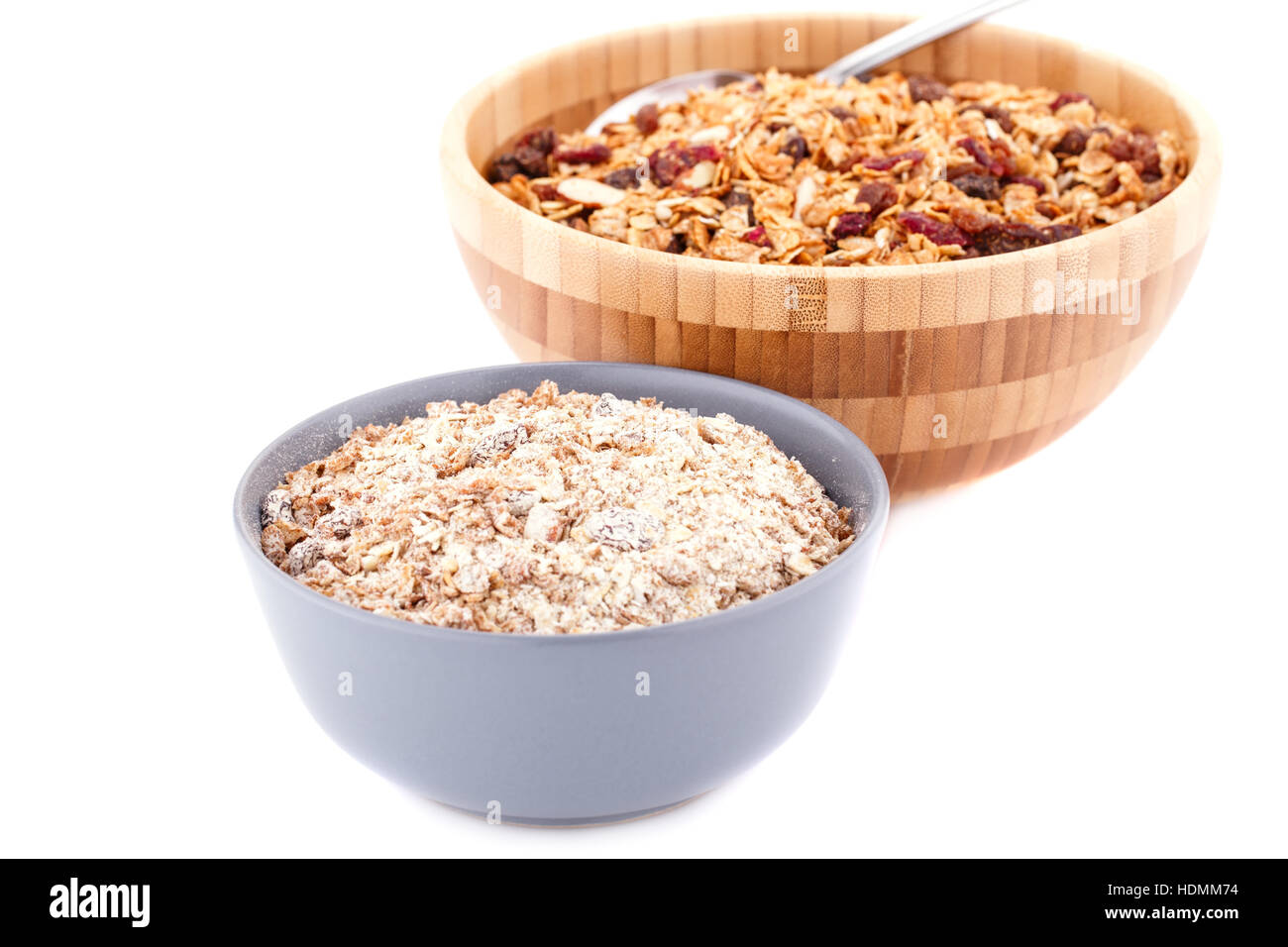 Muesli in the bowls isolated on white background Stock Photo - Alamy