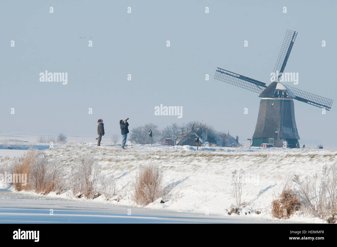 windmill in snow in Dutch winterlandscape Stock Photo - Alamy