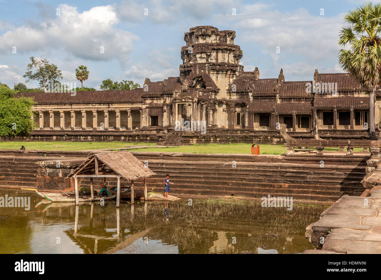 Local Khmer Cambodians use the moat surrounding Angkor Wat temple ...