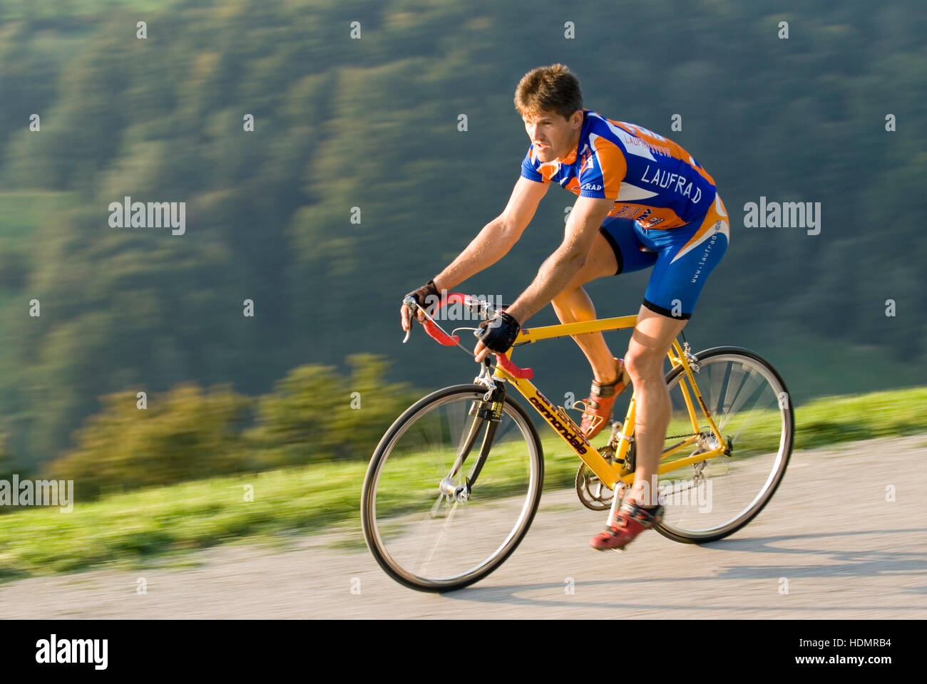 Man riding a racing bicycle Stock Photo - Alamy