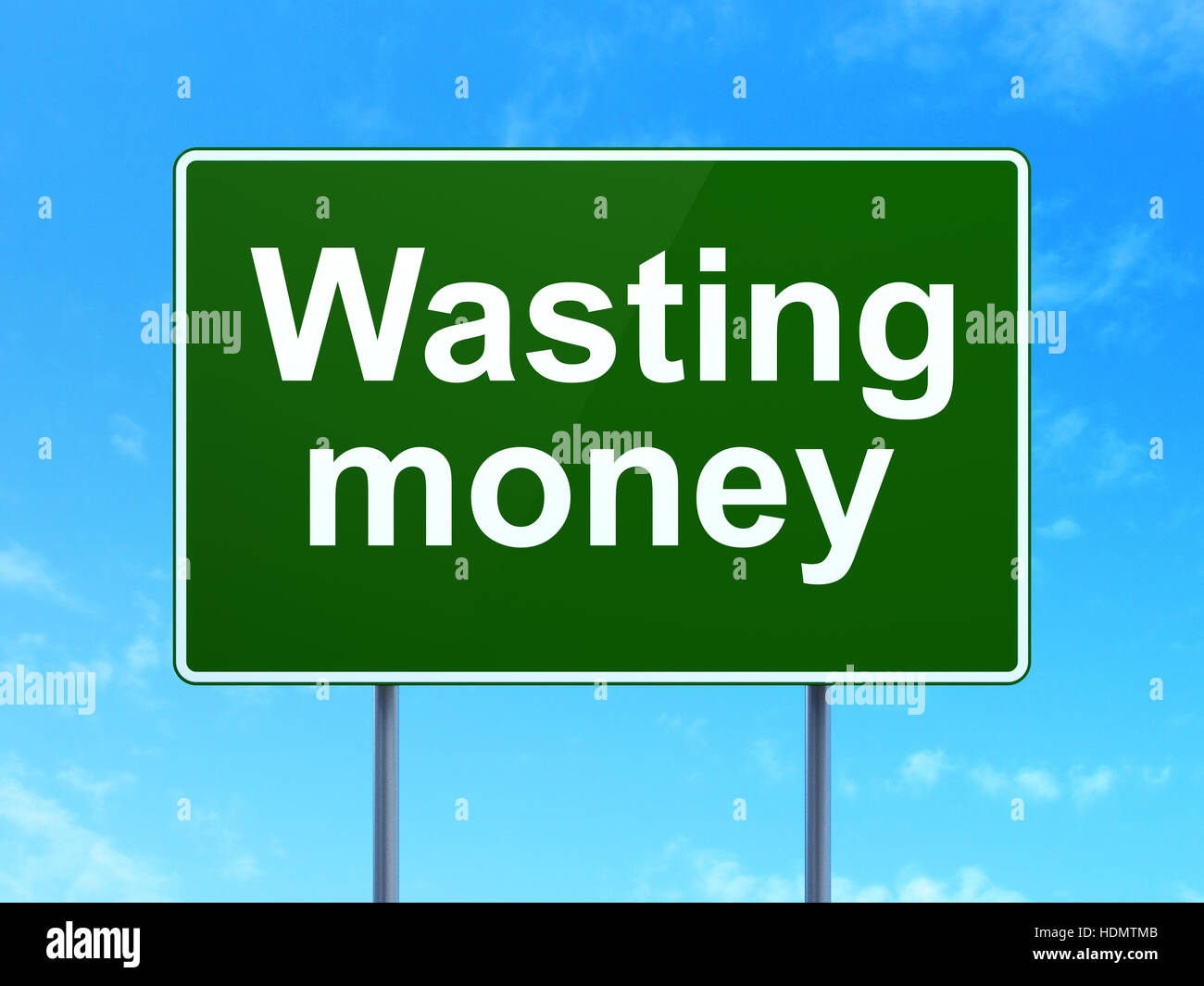 Currency concept: Wasting Money on road sign background Stock Photo - Alamy