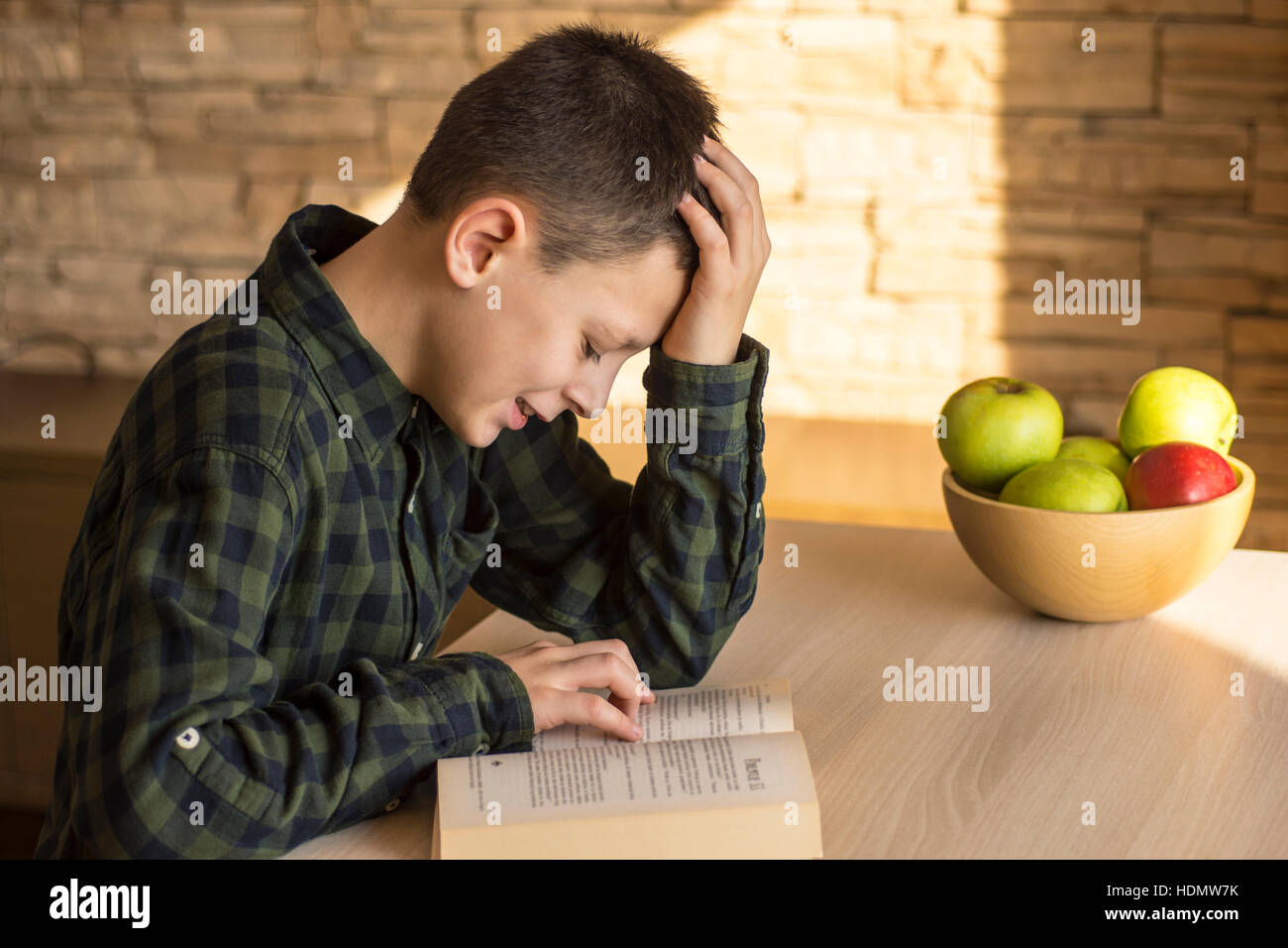 Caucasian teen boy reading book hi-res stock photography and images - Alamy