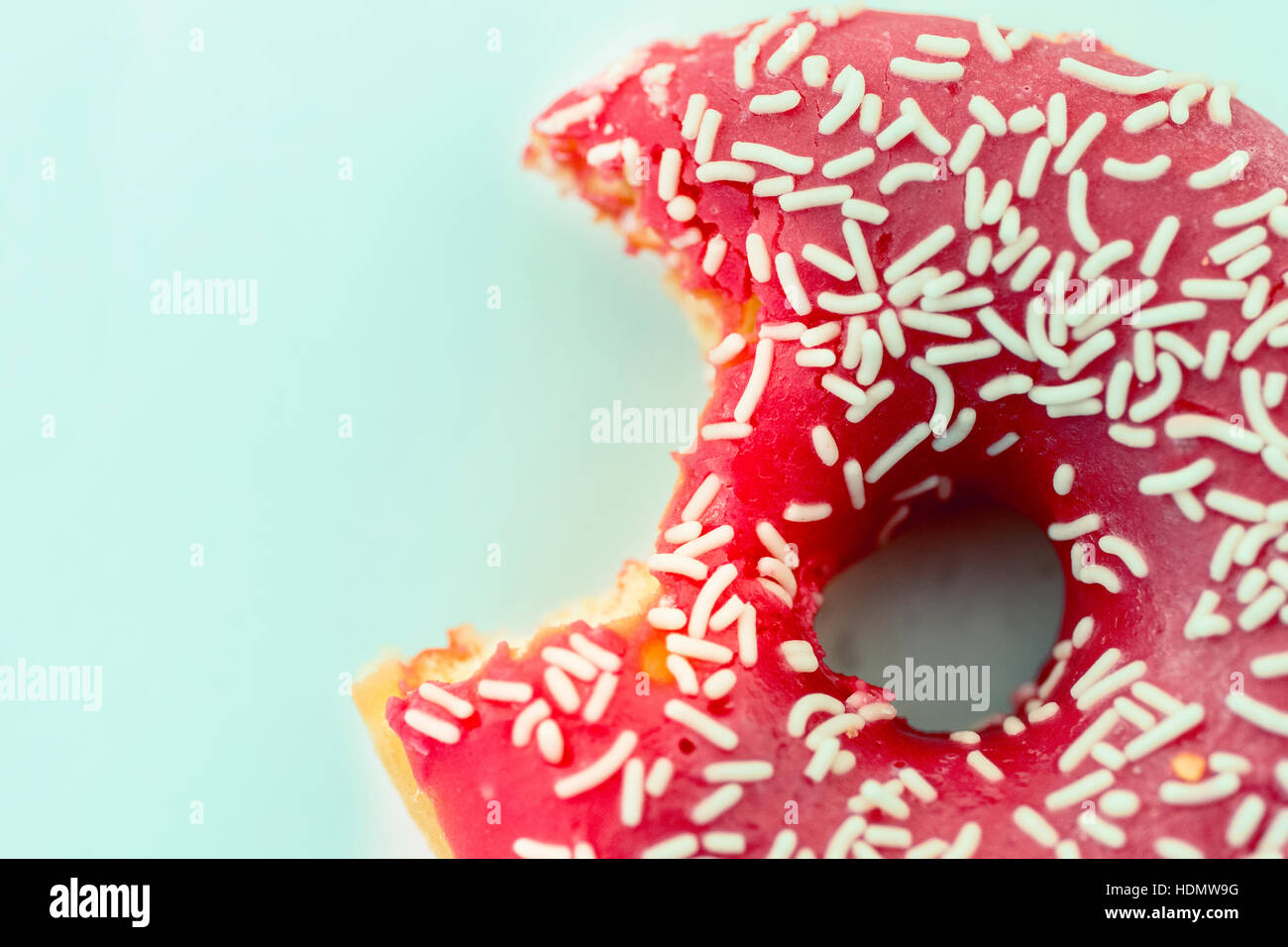 Pink Bitten Donut Close Up Stock Photo - Alamy