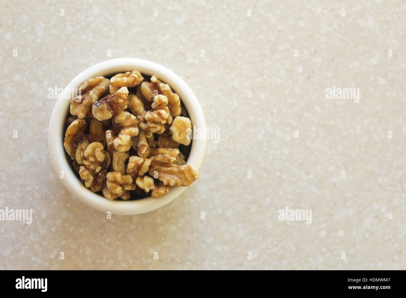 Delicious walnuts in a container on a kitchen countertop, ready to ...