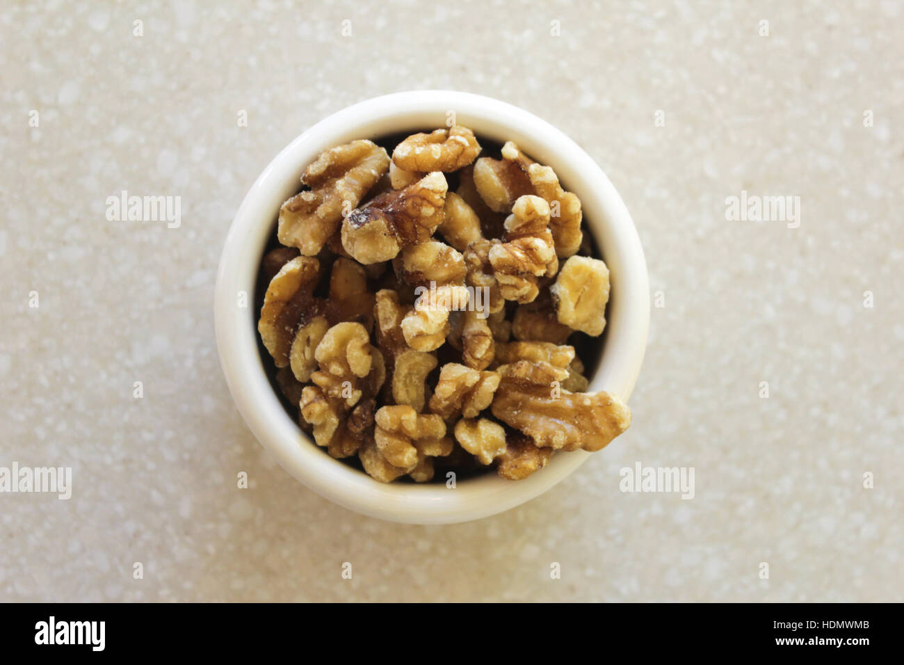 Delicious walnuts in a container on a kitchen countertop, ready to ...